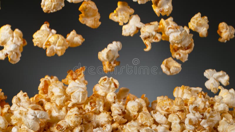 Freeze Motion of Popcorn Flying on Gradient Blue Background. Stock ...
