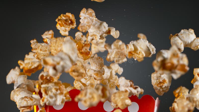 Freeze Motion of Popcorn Flying on Gradient Grey Background. Stock ...