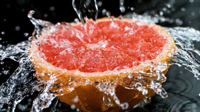 Freeze Motion Shot of Fresh Grapefruit with Water Splash Stock Image ...