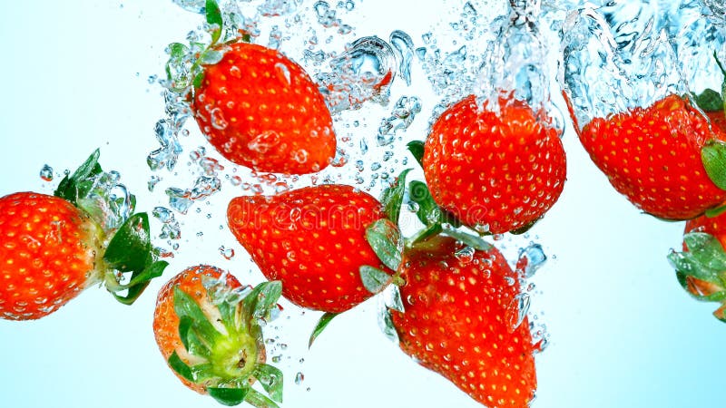 Freeze Motion Shot of Fresh Strawberries Falling into Water Stock Photo ...