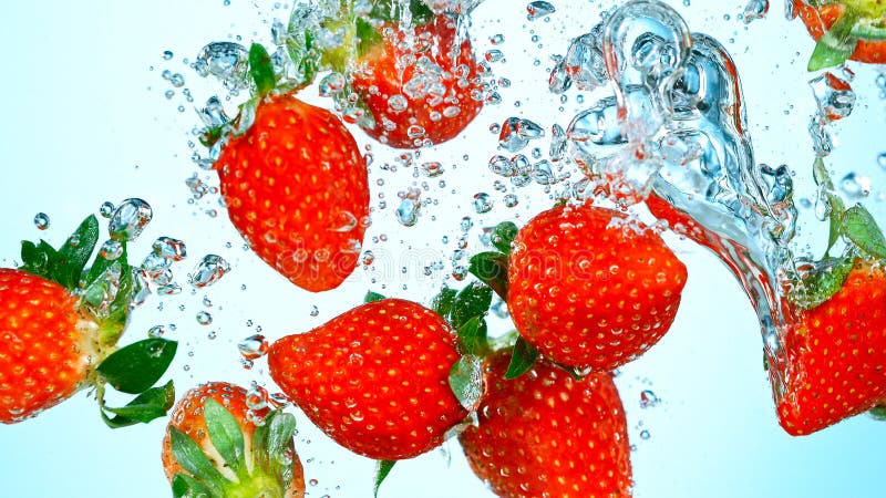 Freeze Motion Shot of Fresh Strawberries Falling into Water Stock Photo ...