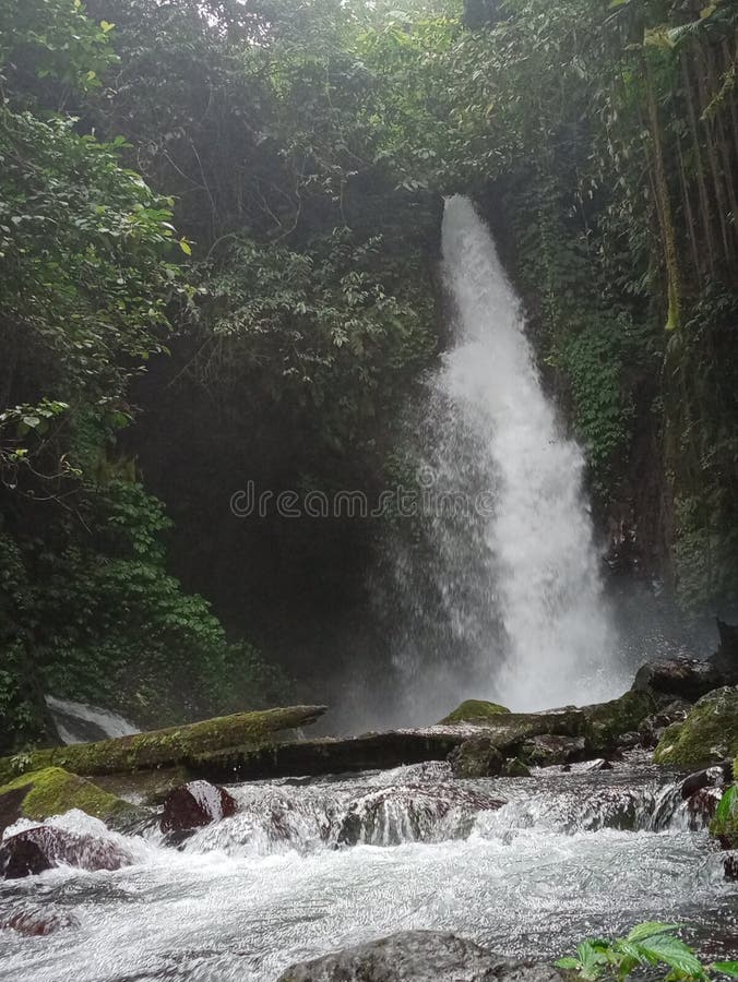 Freezing Waterfall and Beautiful Pebbles Around Stock Photo - Image of ...