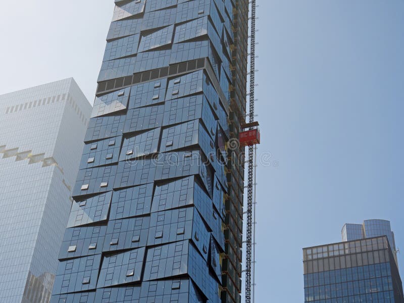Freight Construction Elevator Ascends To Top of a Skyscraper. Temporary ...