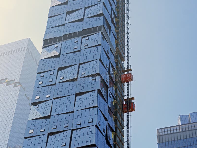 Freight Construction Elevator Ascends To Top of a Skyscraper. Temporary ...
