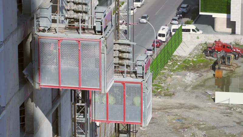 Freight Elevator at the Construction Site of a Tall Building Rides Up ...