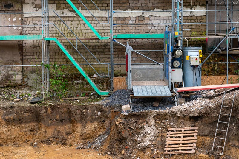 Freight Elevator Near the Scaffolding Around the Erected New Building ...