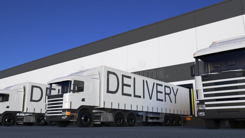 Freight Semi Truck with DELIVERY Caption on the Trailer Loading or ...