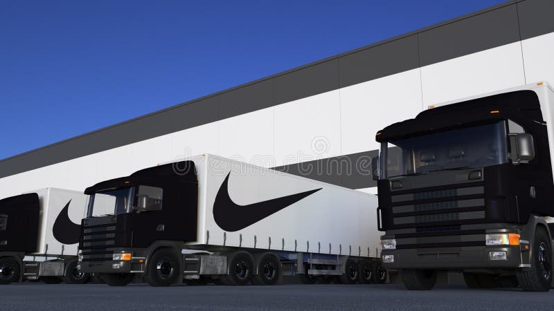Freight Semi Trucks with Nike Inscription and Logo Loading or Unloading ...
