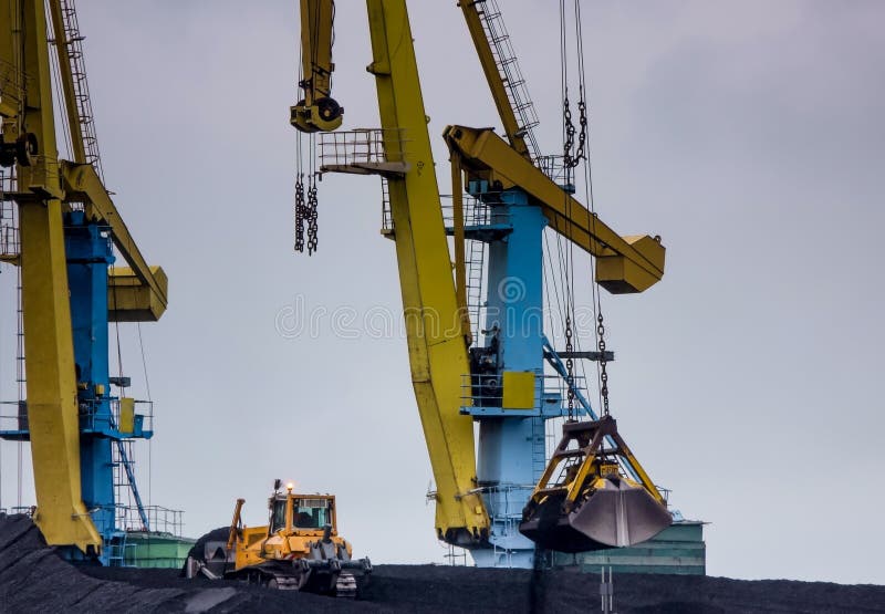 In Freight Terminal, Gantry Crane and Cargo Ships are in Loading and ...