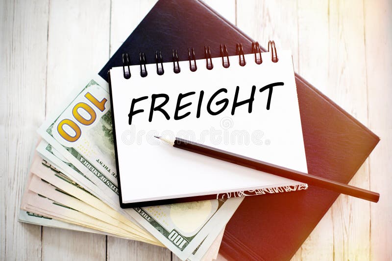 FREIGHT Text Written on Notebook with Dollar Bills and Pencil Stock ...