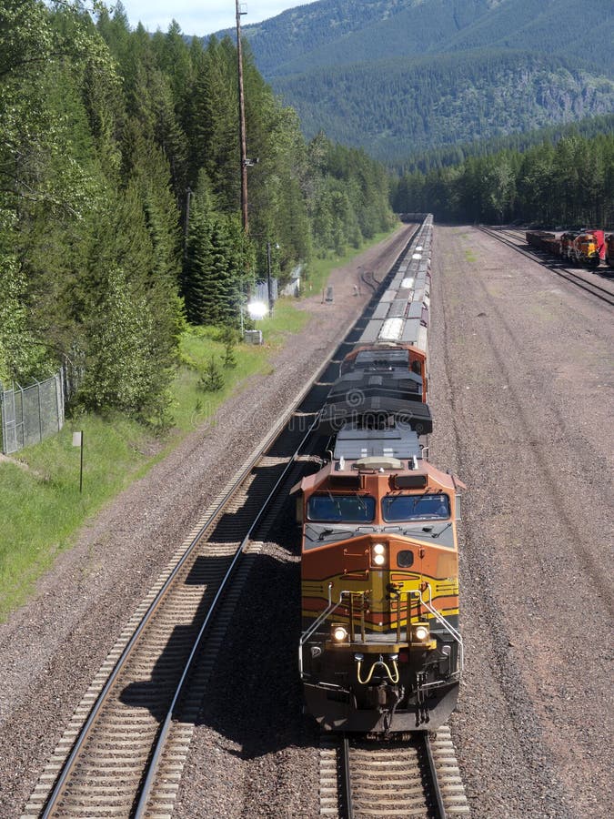 Freight Train Crossing the Mountains Stock Photo - Image of montana ...