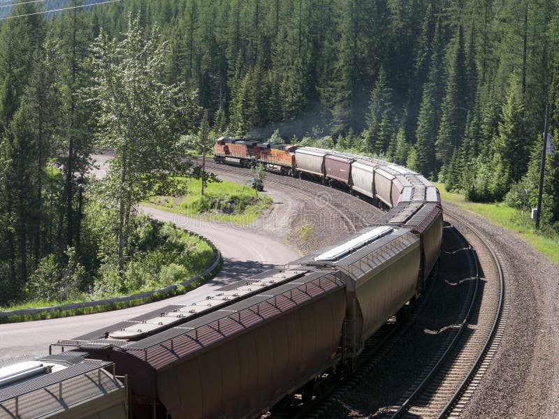 Freight Train Crossing the Mountains Stock Photo - Image of montana ...