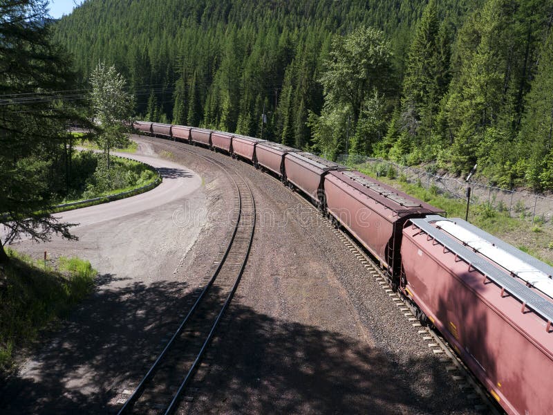 Freight Train Crossing the Mountains Stock Photo - Image of montana ...