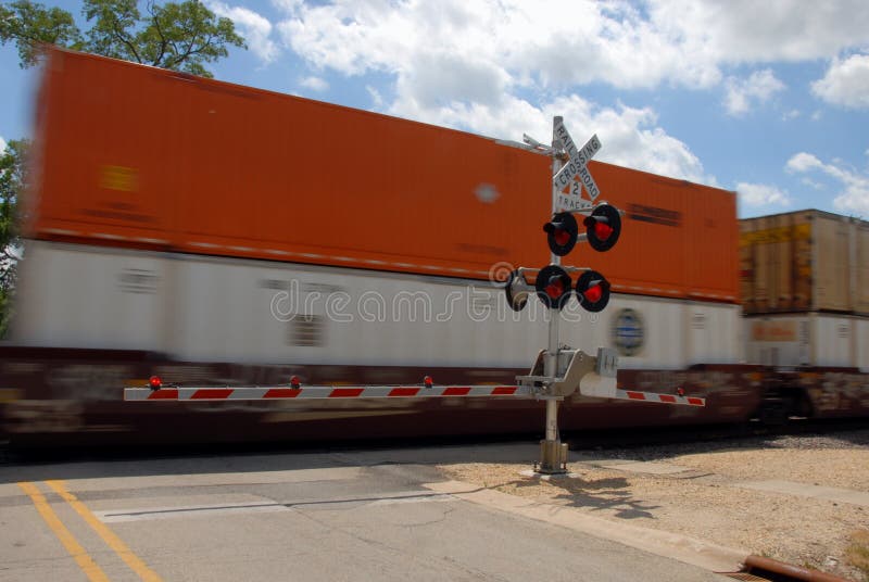 Freight Train Crossing Street Stock Photo - Image of sign, train: 14747526