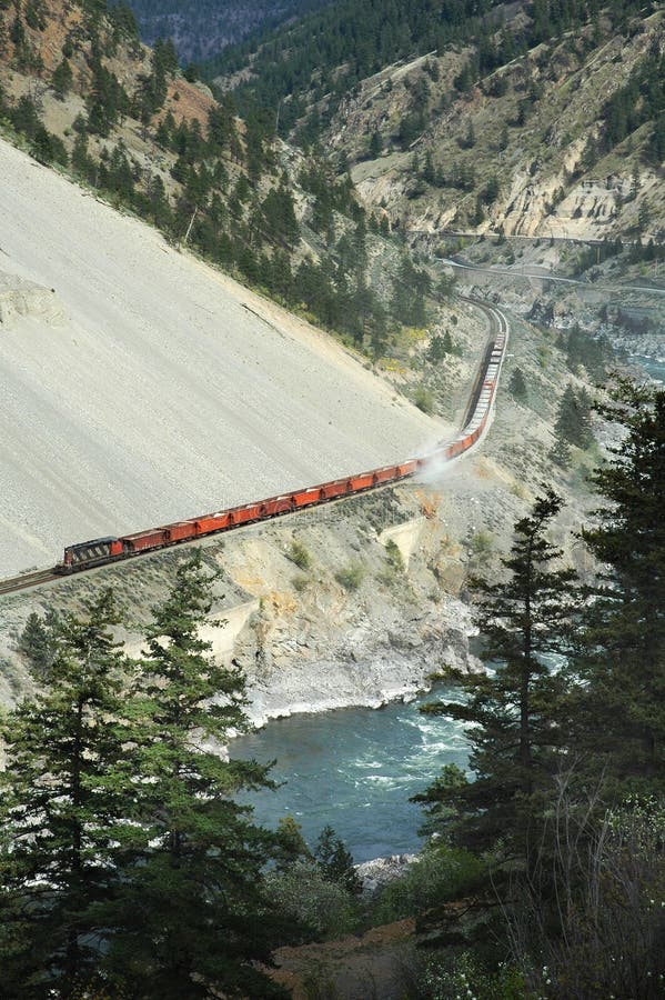 Freight Train Going Through Mountain Area Stock Image - Image of ...