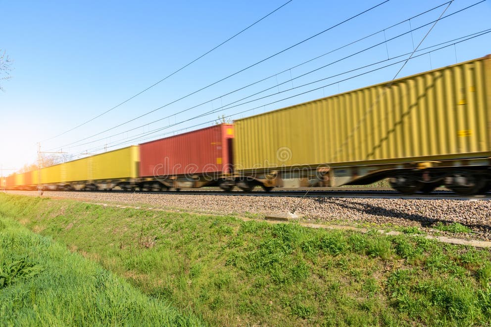 Freight Train in Motion on Clear Spring Day Stock Photo - Image of ...