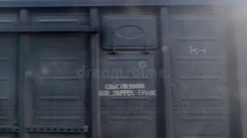 A Freight Train Passes Along the Railway. View from the Window of a ...