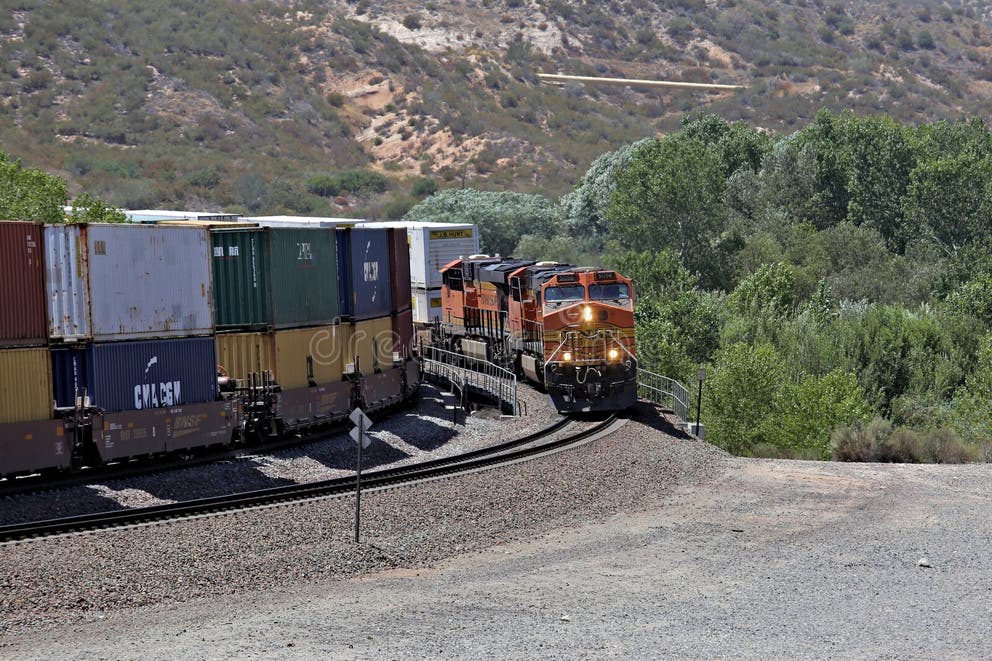 A Freight Train Passes Another Train Going Opposite Direction at the ...