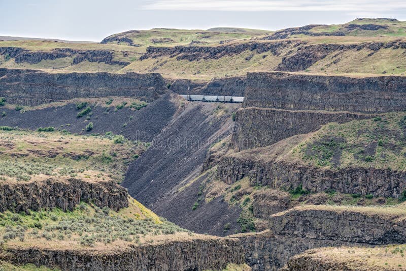 A Freight Train Passes between the Basalt Cliffs of Palouse Falls State ...