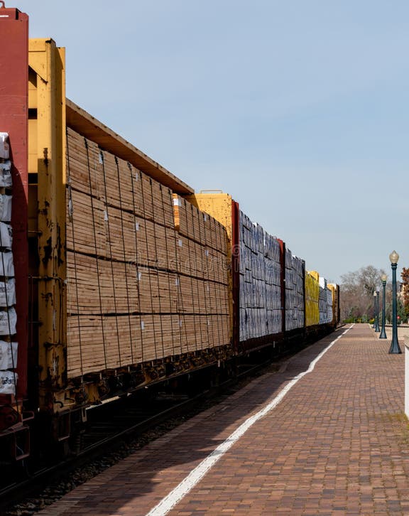 Freight Train Passing Loading Deck of a Depot Stock Image - Image of ...