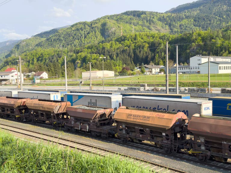 Freight Train Passing through Scenic Mountainous Landscape with Cargo ...
