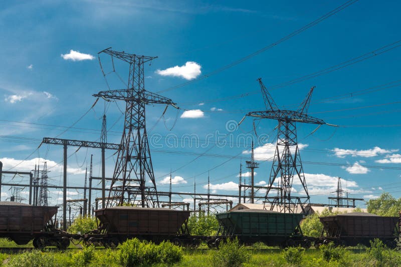 Freight Train Is Passing By Thermal Power Stations And Power Lines ...