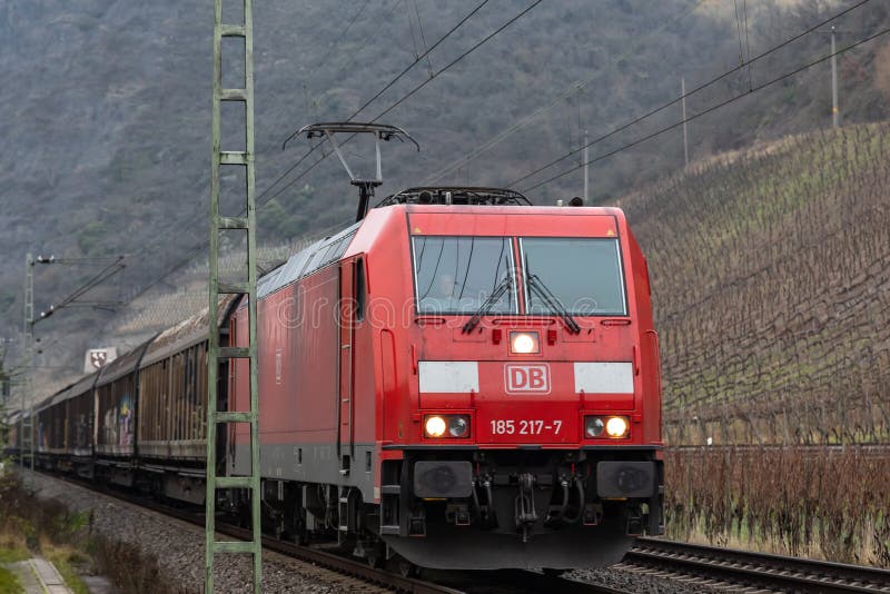 A Freight Train with a Red Electric Locomotive Editorial Stock Image ...