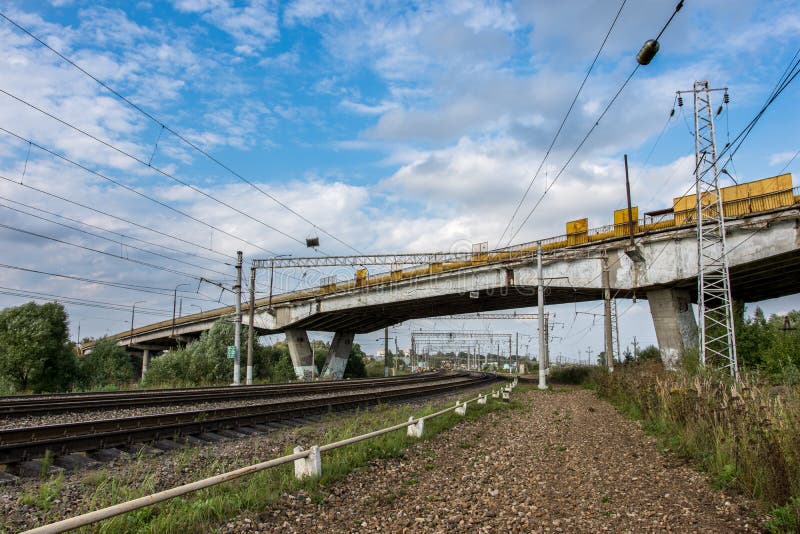 Freight Train Rides by Rail Under the Road Bridge Stock Photo - Image ...