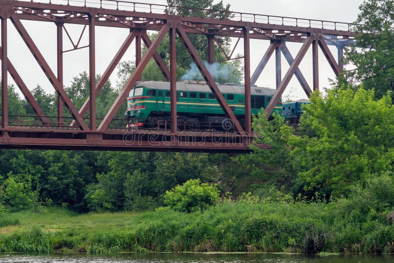 Freight Train Rides on a Railway Bridge Over the River Stock Photo ...