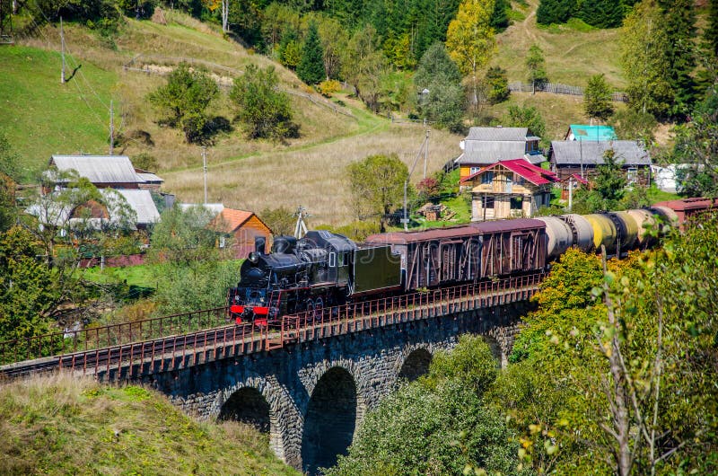 Freight Train with Steam Locomotive Stock Photo - Image of bridge ...