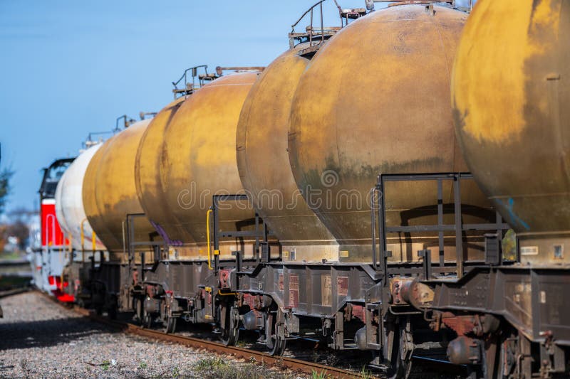 Freight Train Transporting Tanks through an Industrial Area.. Stock ...