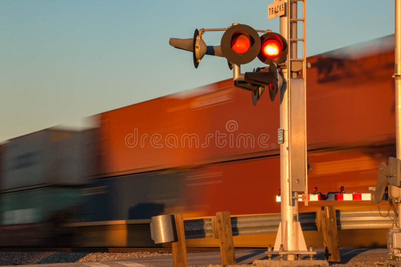Freight Train through Crossing Stock Photo - Image of blur, iron: 228974286