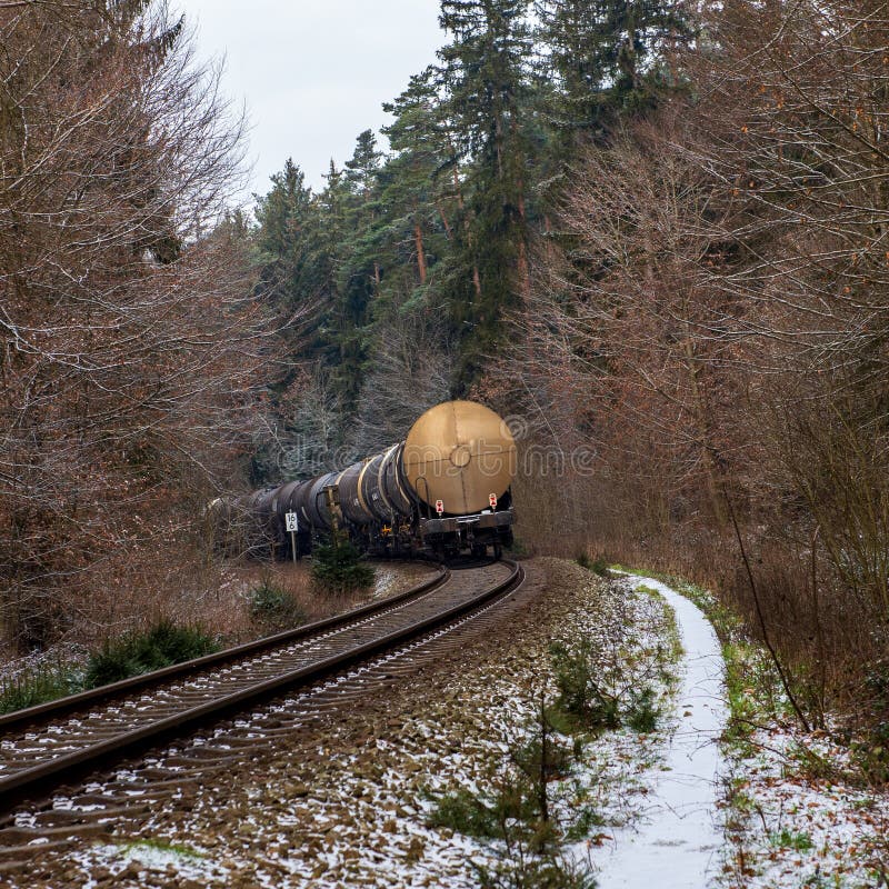 Freight train in winter stock image. Image of tank, metal - 267078399