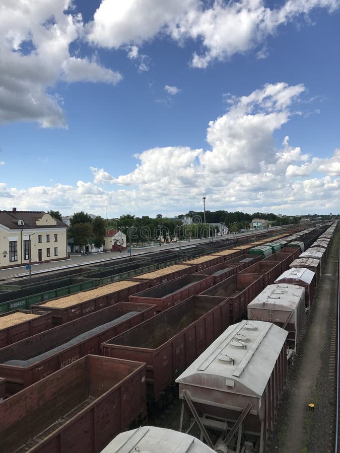 Freight Trains at the Railway Station. Open Freight Wagons with Cargo ...