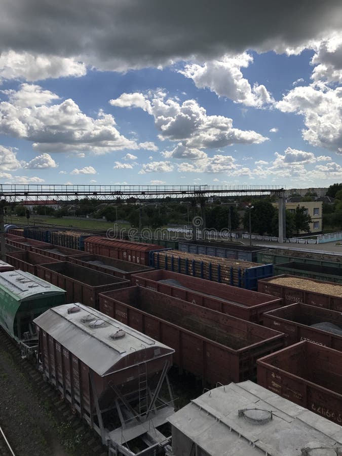 Freight Trains at the Railway Station. Open Freight Wagons with Cargo ...