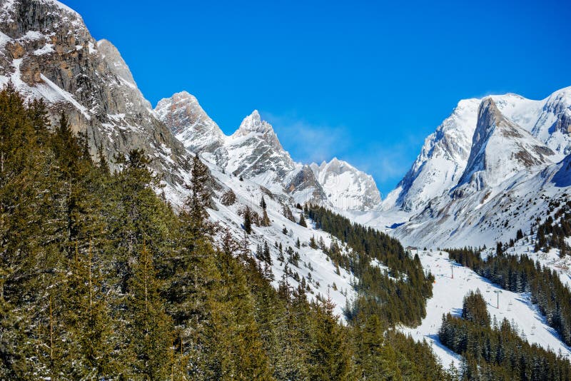 French Alps Summits and Green Forest on Slopes Stock Photo - Image of ...