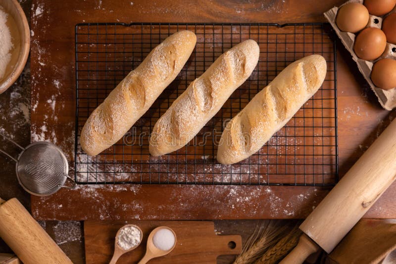 French Bread Baguettes on the Wooden Table Stock Photo - Image of ...