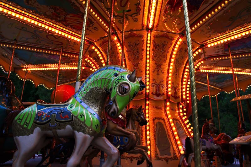 Old French Carousel in a Holiday Park. Three Horses on a Traditional ...