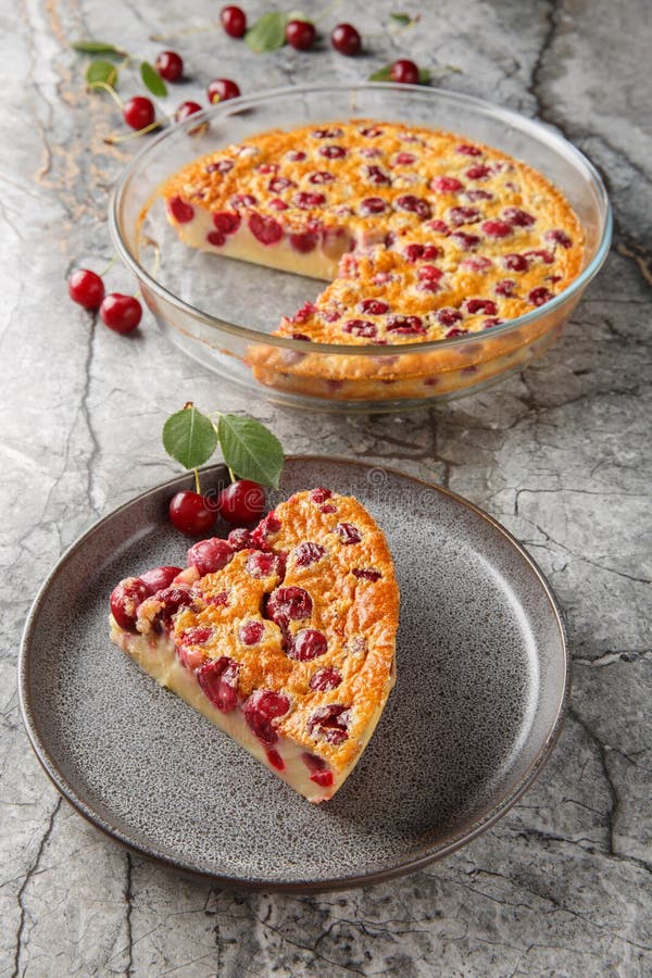 French Clafoutis Pie with Cherries and a Slice on a Plate Close-up ...