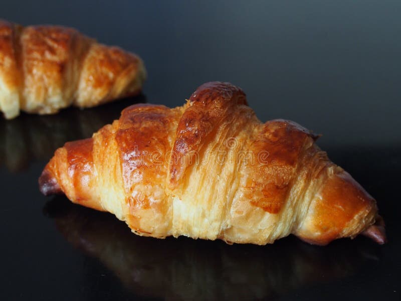 French Croissant Half, Black Surface Stock Photo - Image of french ...