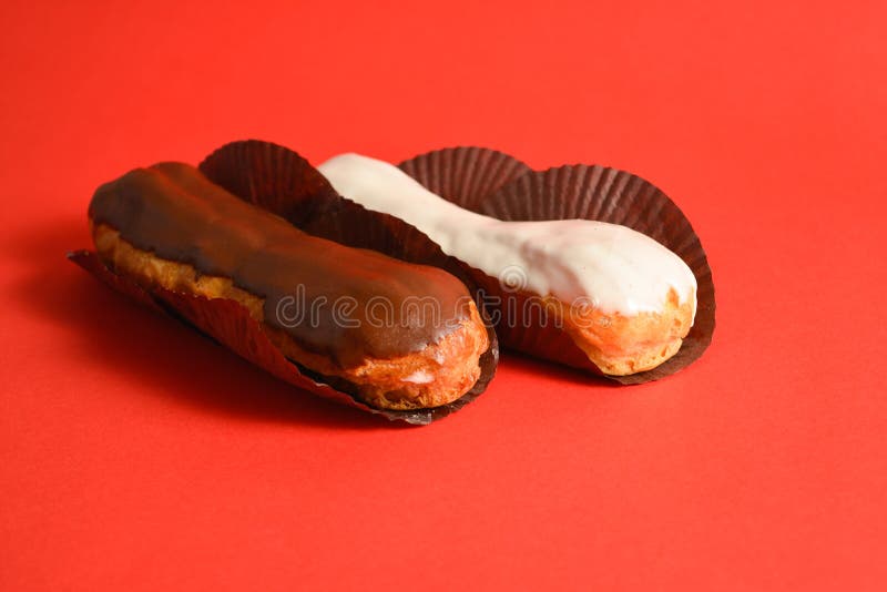 French Desserts Eclairs with White Chocolate and Dark Chocolate on Top ...