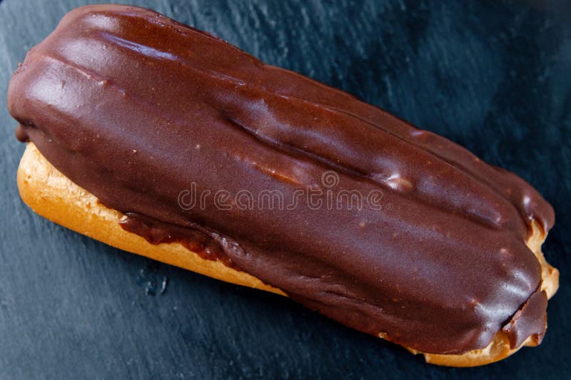 French Ecler with Chocolate. Traditional French Dessert Eclair Stock ...