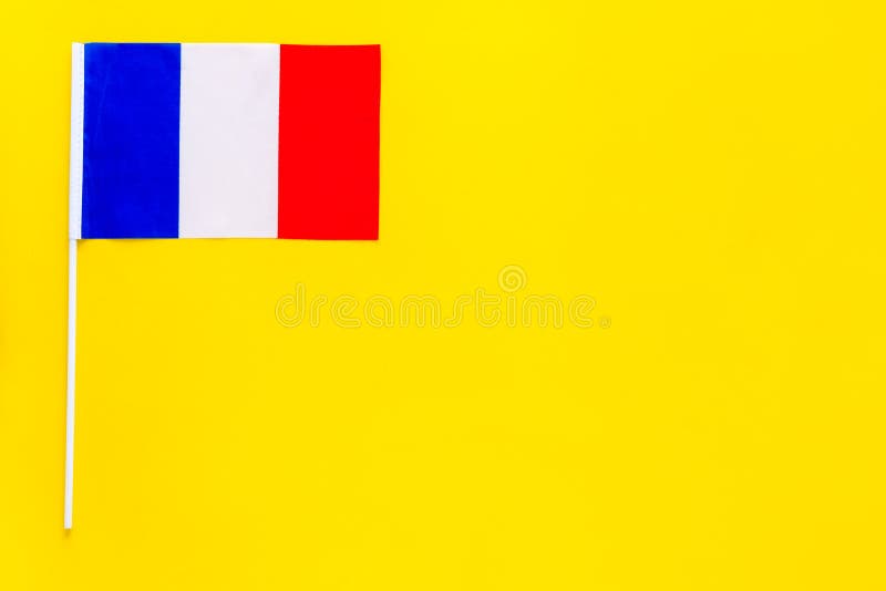 French Flag Concept. Small Flag on Yellow Background Top View Copy ...