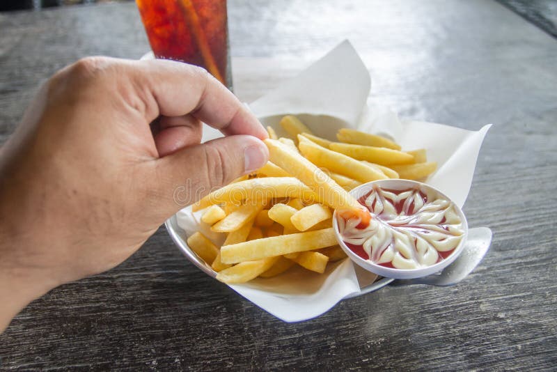 French Fry Being Dipped In Ketchup Stock Photo - Image of chip, cooked ...