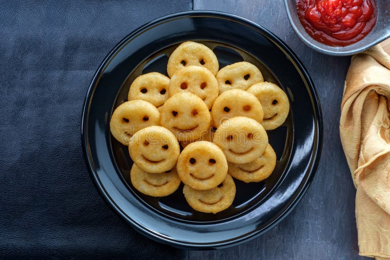 French Fried Potato Smiles stock photo. Image of fattening - 165573034