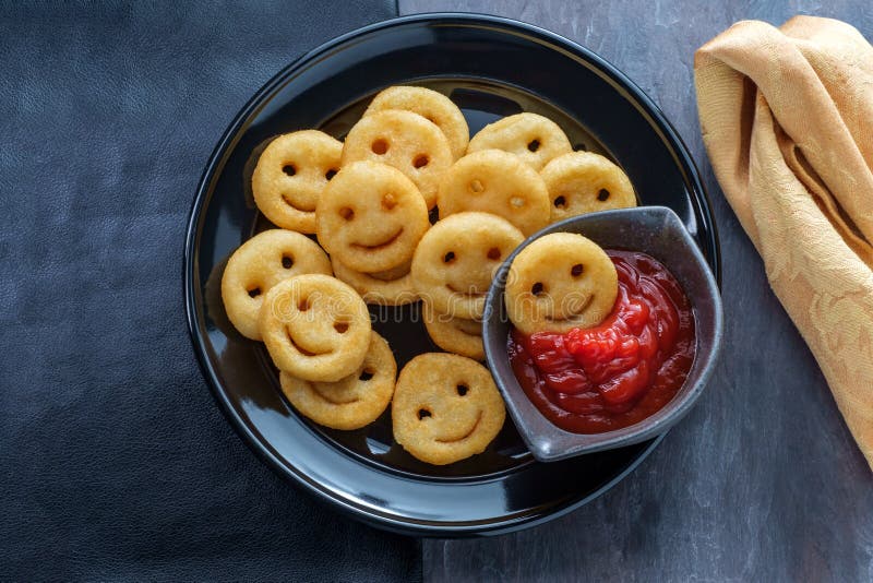 French Fried Potato Smiles stock photo. Image of fattening - 165573290