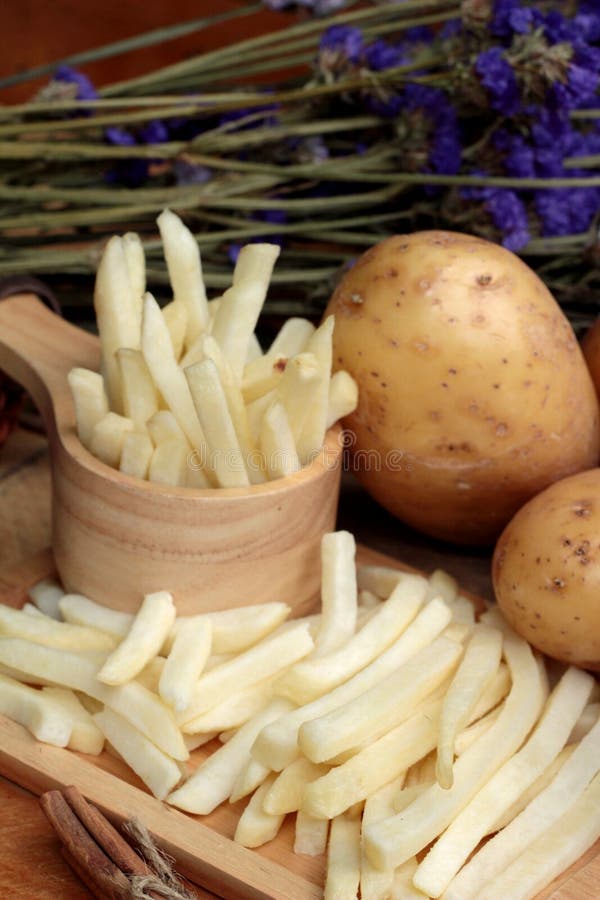 French Fries and Fresh Potatoes Sliced Stock Image - Image of sliced ...