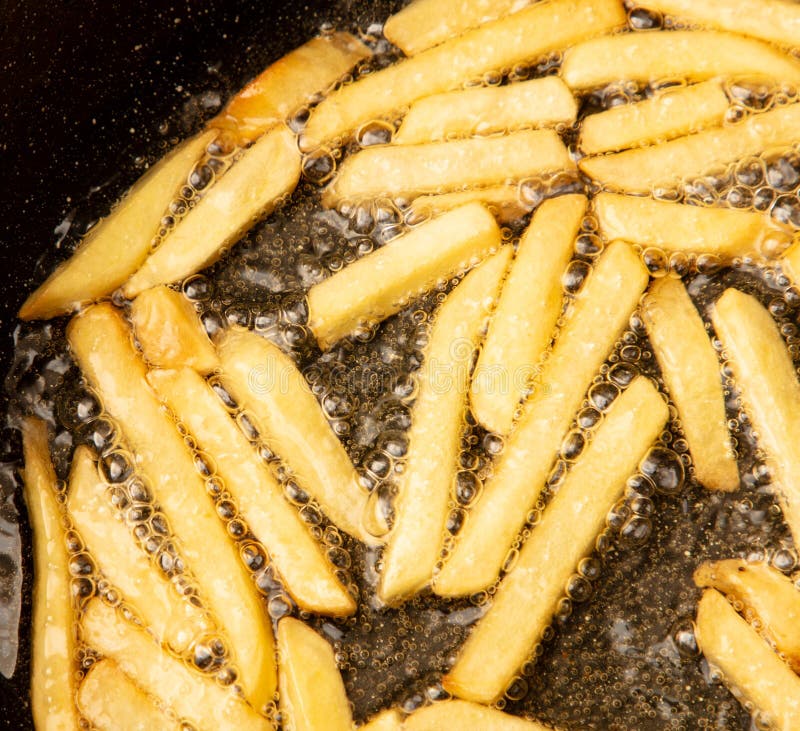 French Fries are Fried in Oil in a Frying Pan Stock Photo - Image of ...