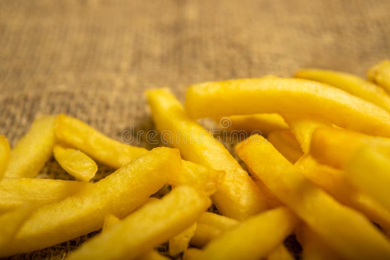 French Fries on a Homespun Fabric with a Rough Texture. Close Up Stock ...