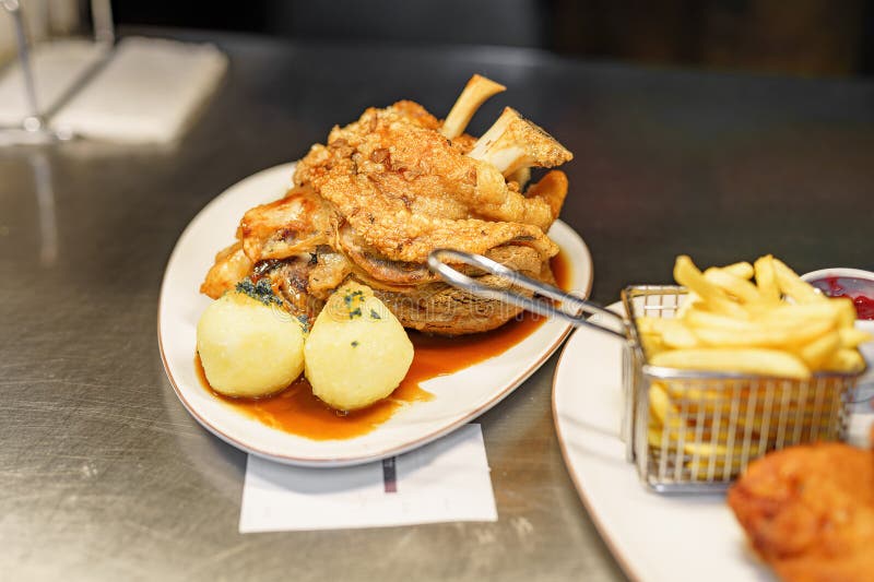 French Fries and Meat in Dough on a Plate in a Restaurant Stock Image ...